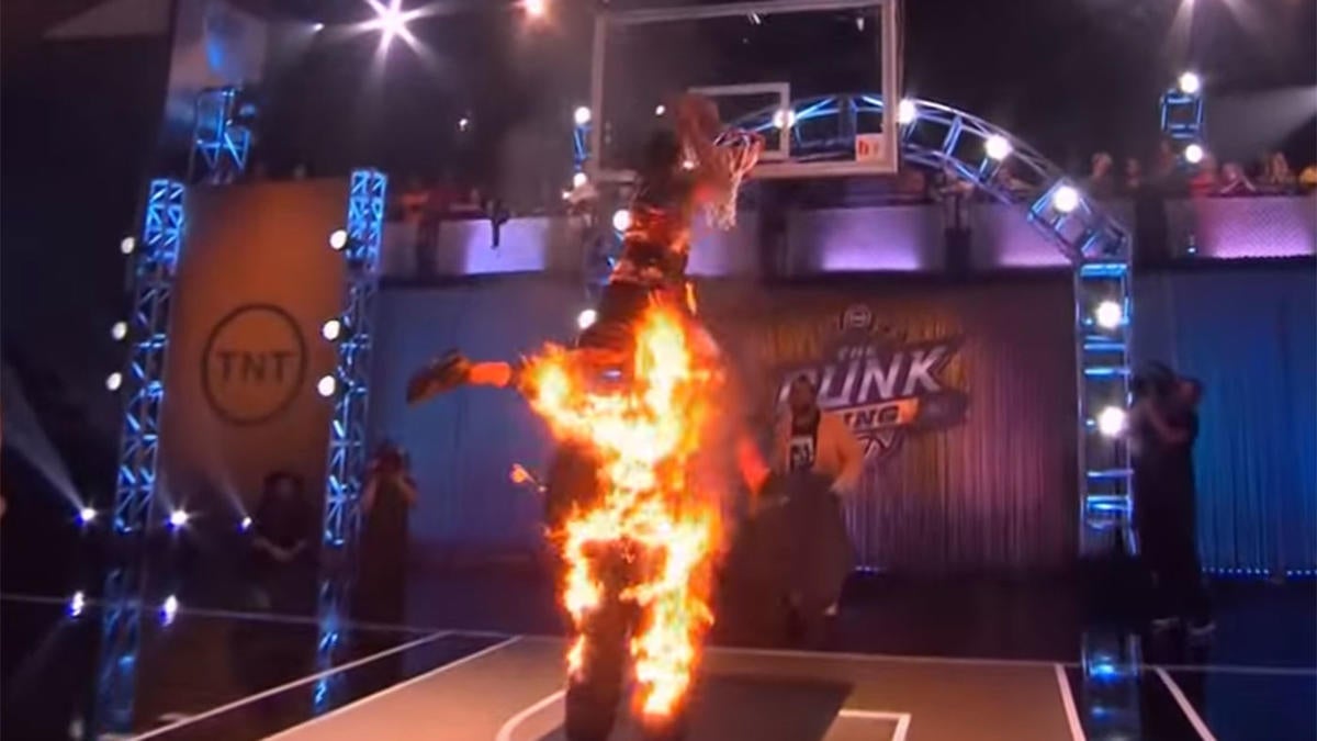 WATCH: Guy dunks over human fireball, somehow still loses contest ...