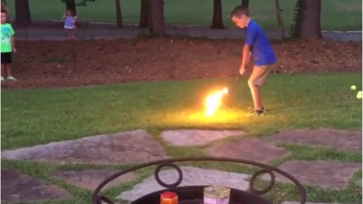 WATCH: Kid lights fireworks by chipping flaming golf ball into a fire ...