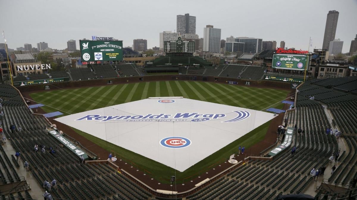 Fan carted off after falling from Wrigley Field bleachers onto warning ...