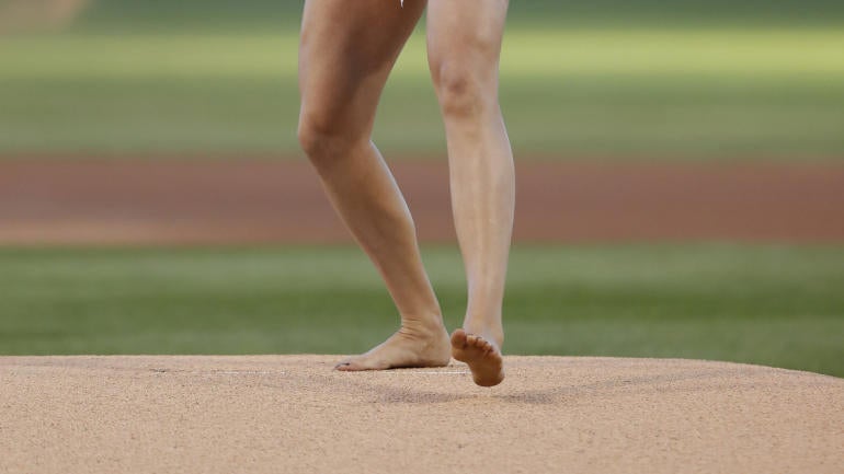 LOOK: Barefoot Olympian throws first pitch at Wrigley Field - CBSSports.com