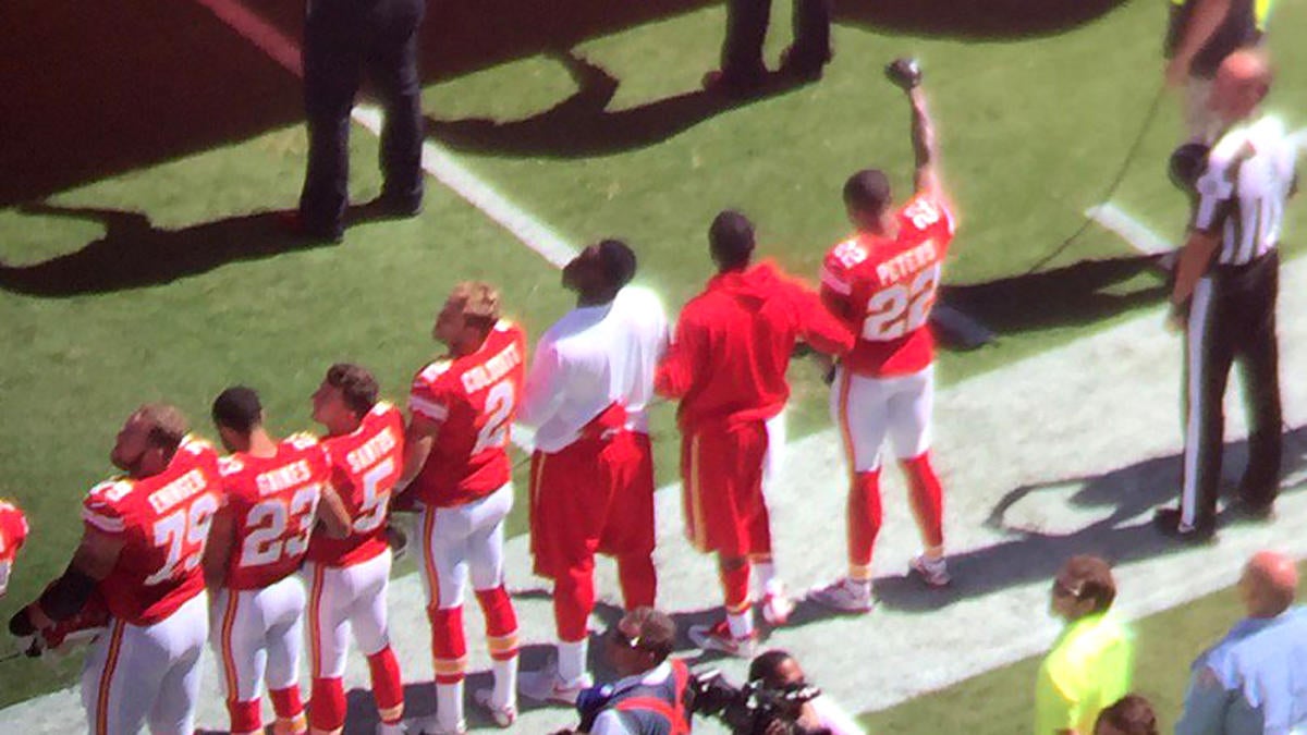 Chiefs interlock arms, Marcus Peters raises right fist during national ...