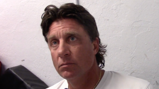 Mike Gundy and Justice Hill on receiver Landon Wolf