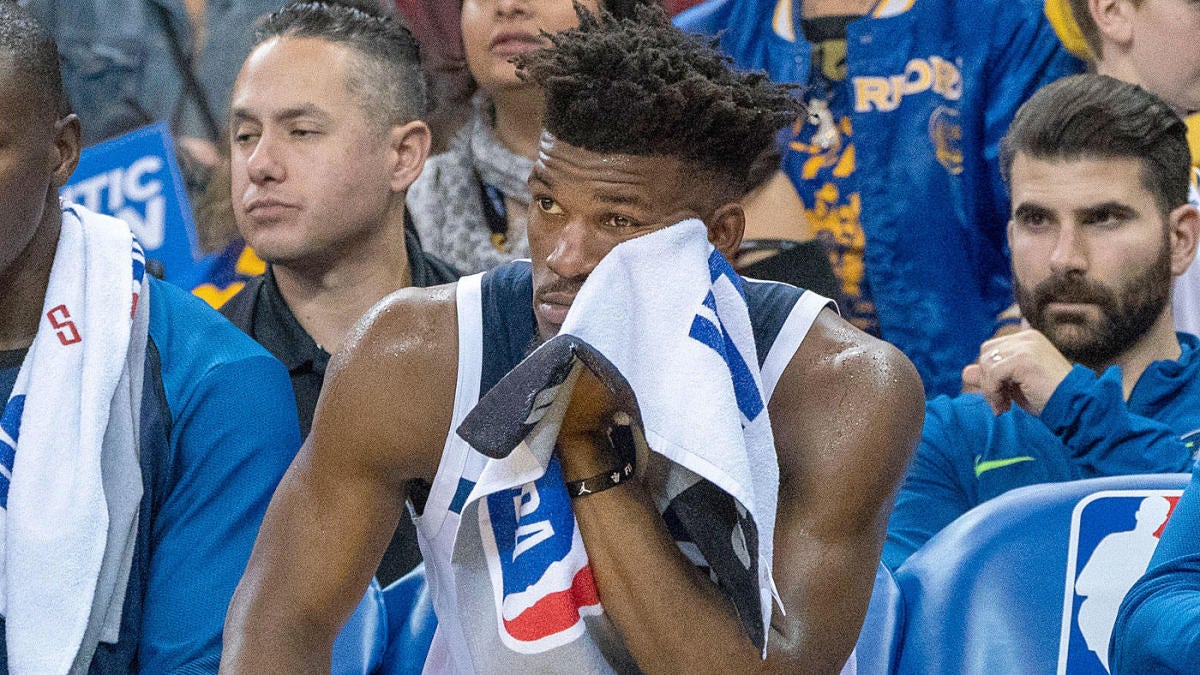 Wolves' Jimmy Butler joins Warriors fans by waving a towel on the bench ...