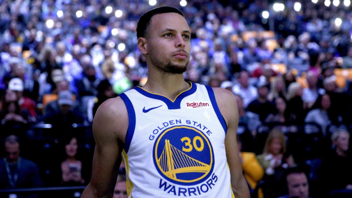 Warriors' Steph Curry holds up James Harden's No. 13 after getting ...