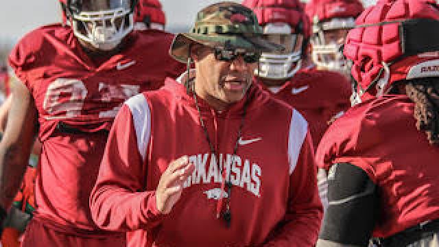 Deke Adams working with defensive line during spring drills