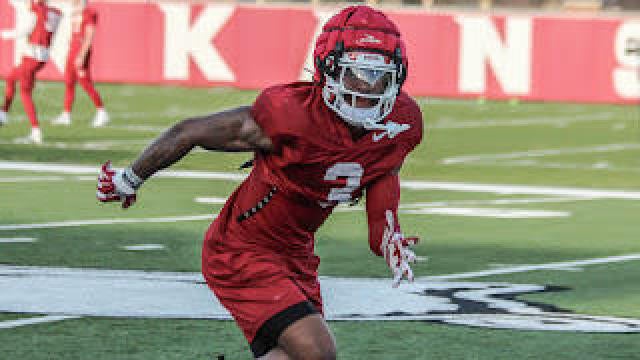Deron Wilson working with secondary during spring drills