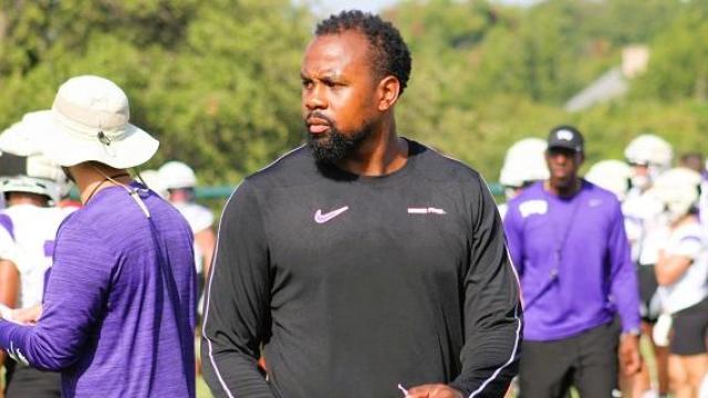 TCU WR coach Malcolm Kelly talks outside receiver room